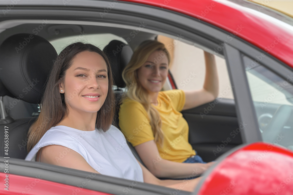Young beautiful women in the car. Happy lady inside the car. Travel ...