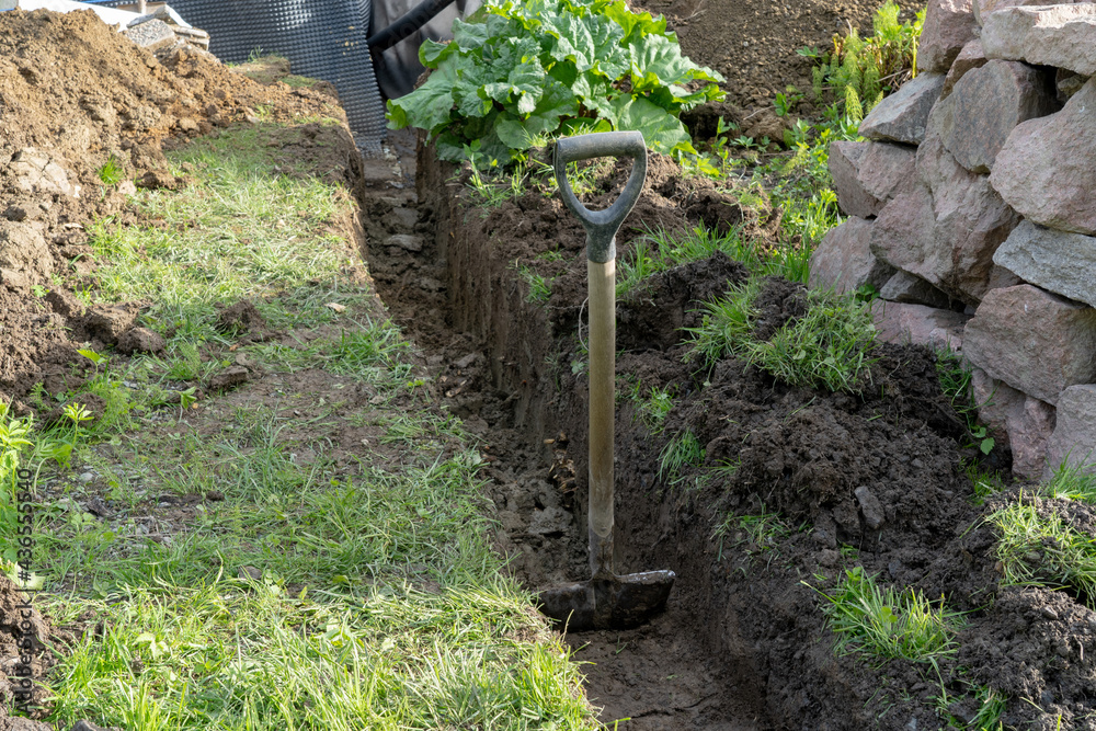 Digging ground to make drainage home. Stock Photo | Adobe Stock