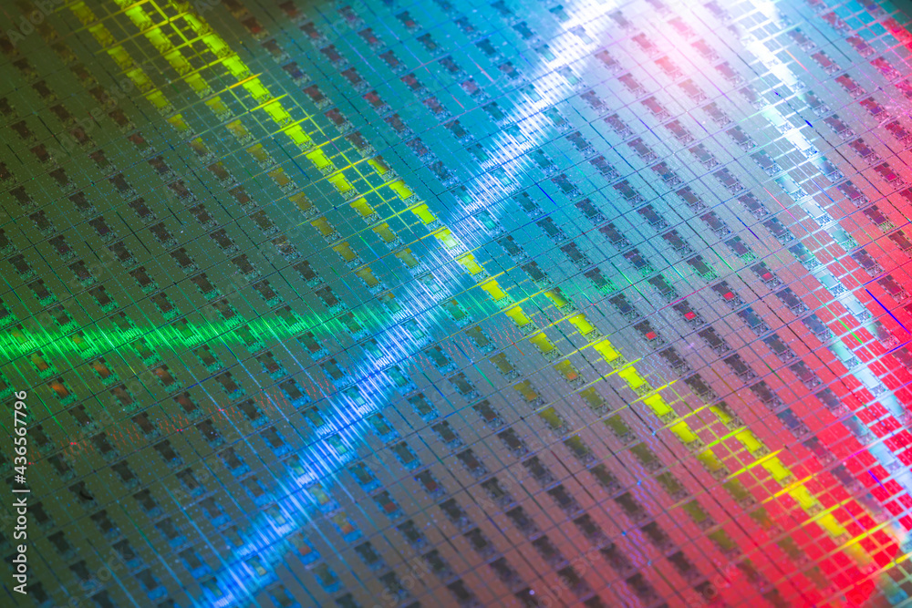 silicon wafer reflecting different colors. Stock Photo | Adobe Stock
