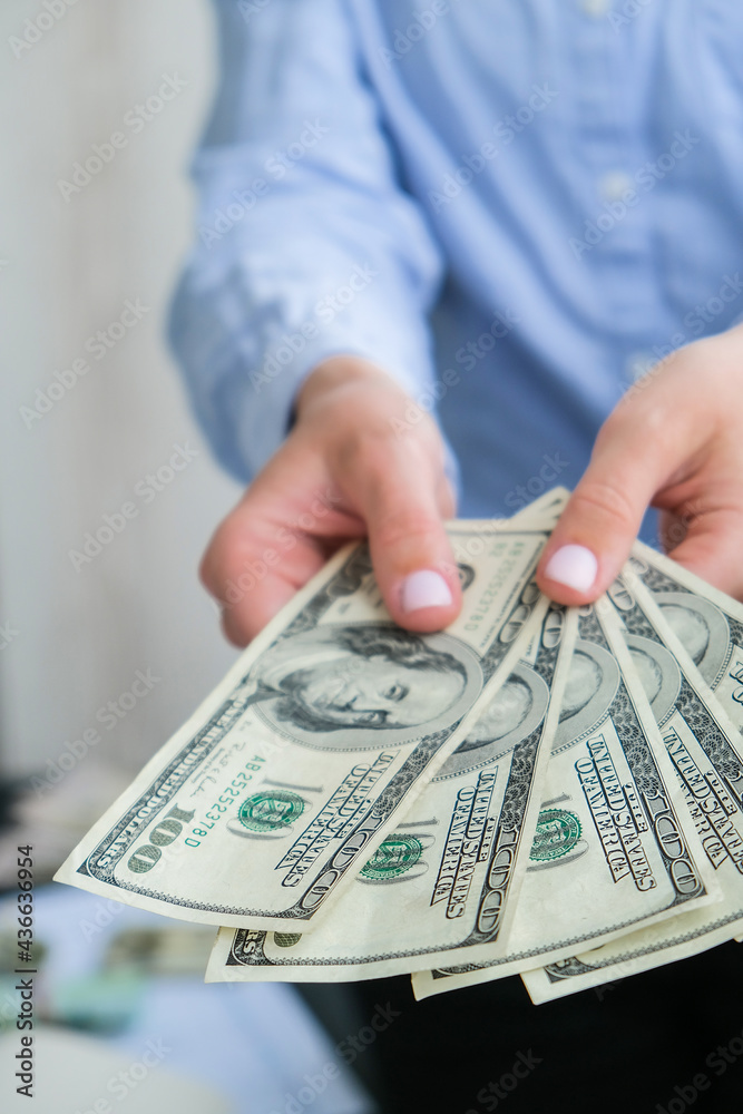 Business Woman Displaying a Spread of Cash US dollars. Close-up. Income ...