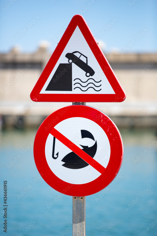 Road hazard sign showing a car falling off the end of a pier, and no ...