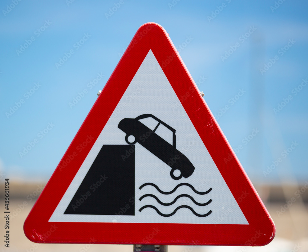 Road hazard sign showing a car falling off the end of a pier Stock ...