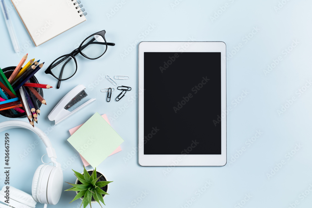 Online learning design concept. Top view of student table with tablet ...