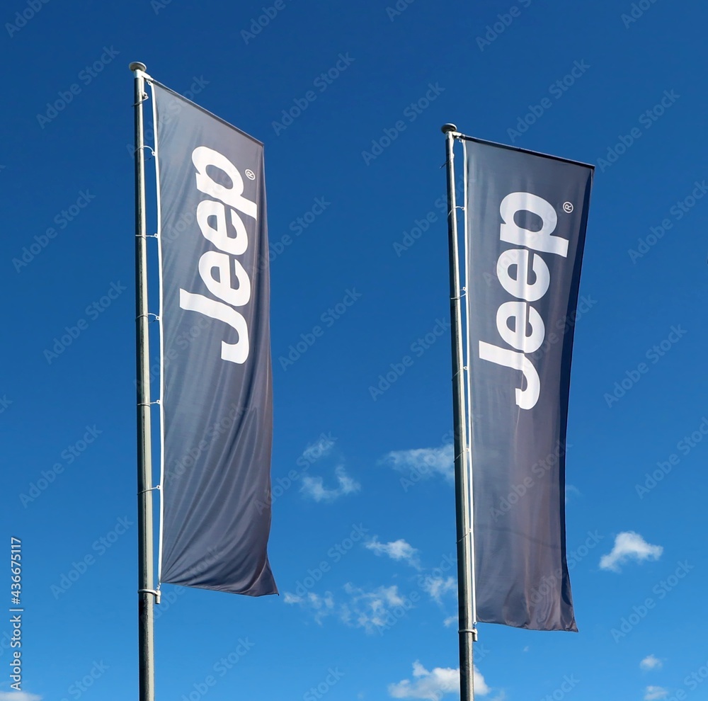 Tarcento, Italy. May, 30 2021. Banner flags of Jeep outside the local ...