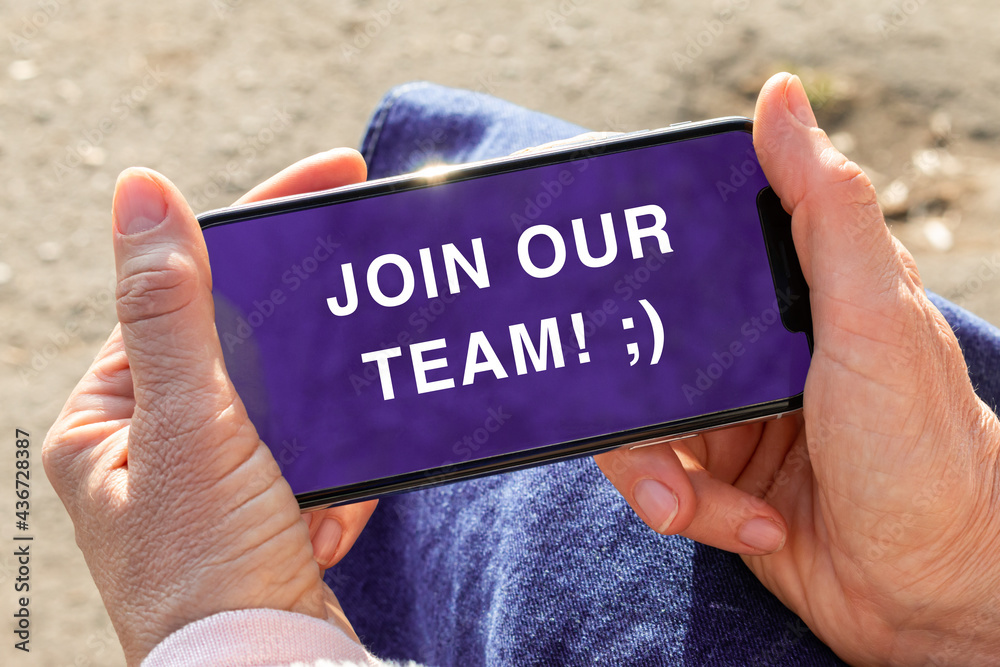 Join our team message with smile on the screen of modern smartphone ...