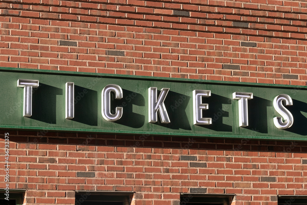 Ticket Window Sign in white text, with a green and brick background ...