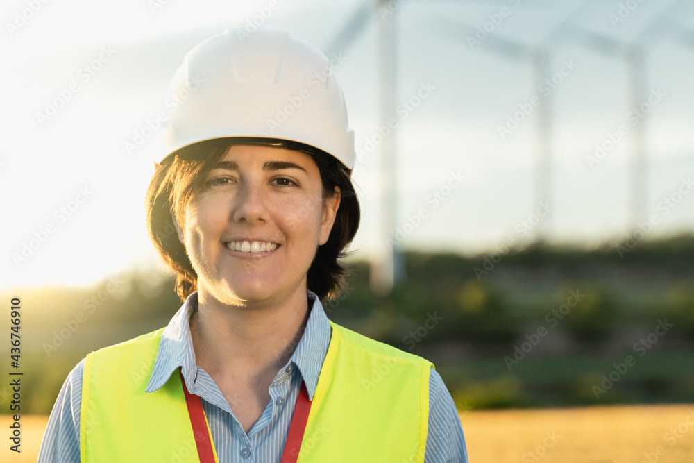 Sustainable energy - Engineer working at solar farm construction with ...
