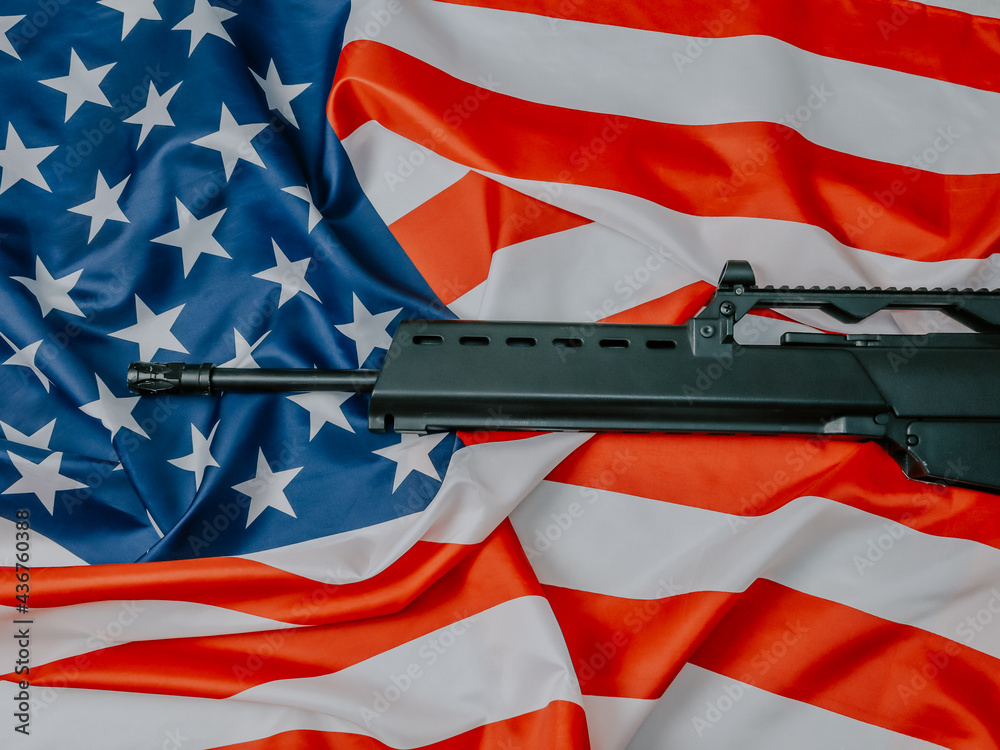 American flag and machine gun. The machine gun lies on the American ...