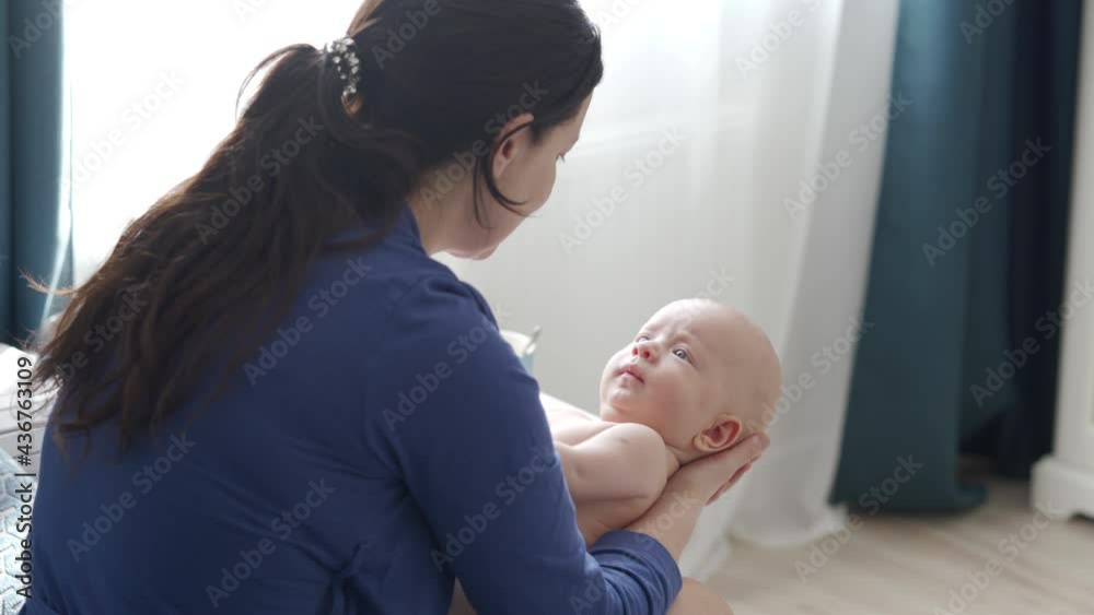 Face-to-face interaction between infant and mother, happy mother and ...