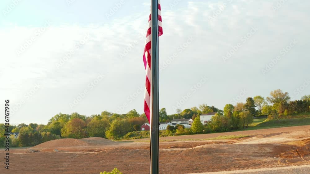 American flag at rest. Calm day with no wind. Magic hour light. Rising ...