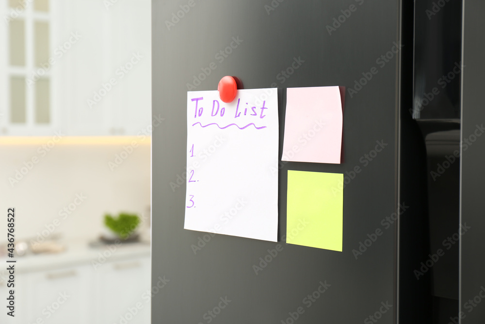 Blank To do list and sticky notes on fridge in kitchen. Space for text ...