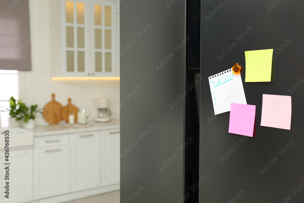 Blank To do list and sticky notes on fridge in kitchen. Space for text ...