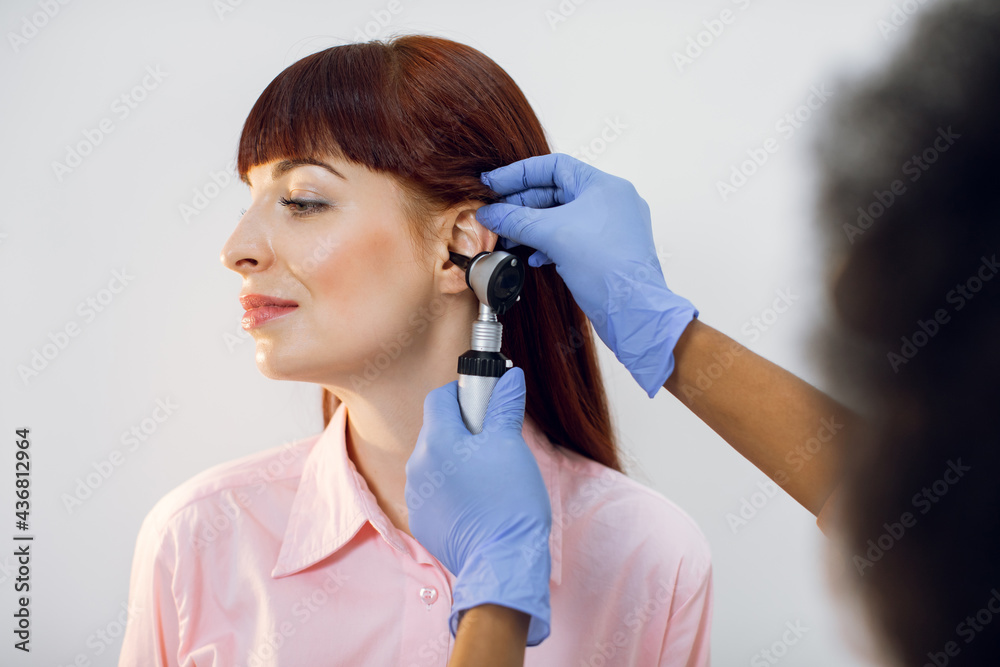 Hearing loss and otitis treatment concept. Close up of female young ...