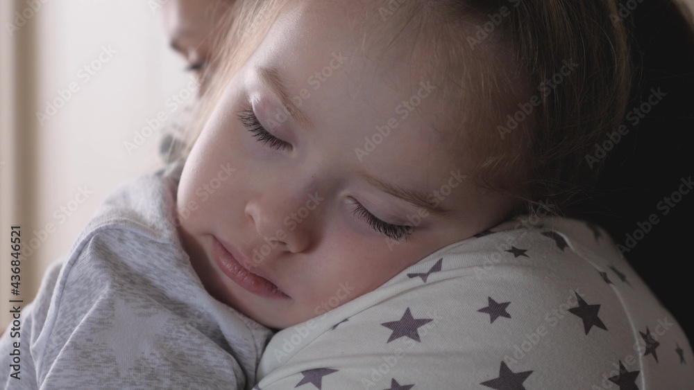 Fotografia do Stock: Baby, child sleeps in her mother's arms. A loving ...