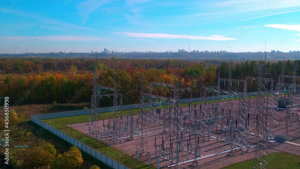 High-voltage towers at the substation. A beautiful view of the dense ...