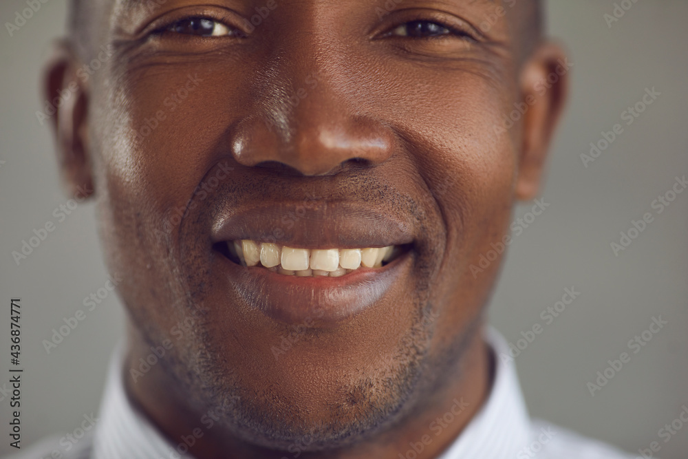 Extreme closeup portrait of happy cheerful handsome young black man ...