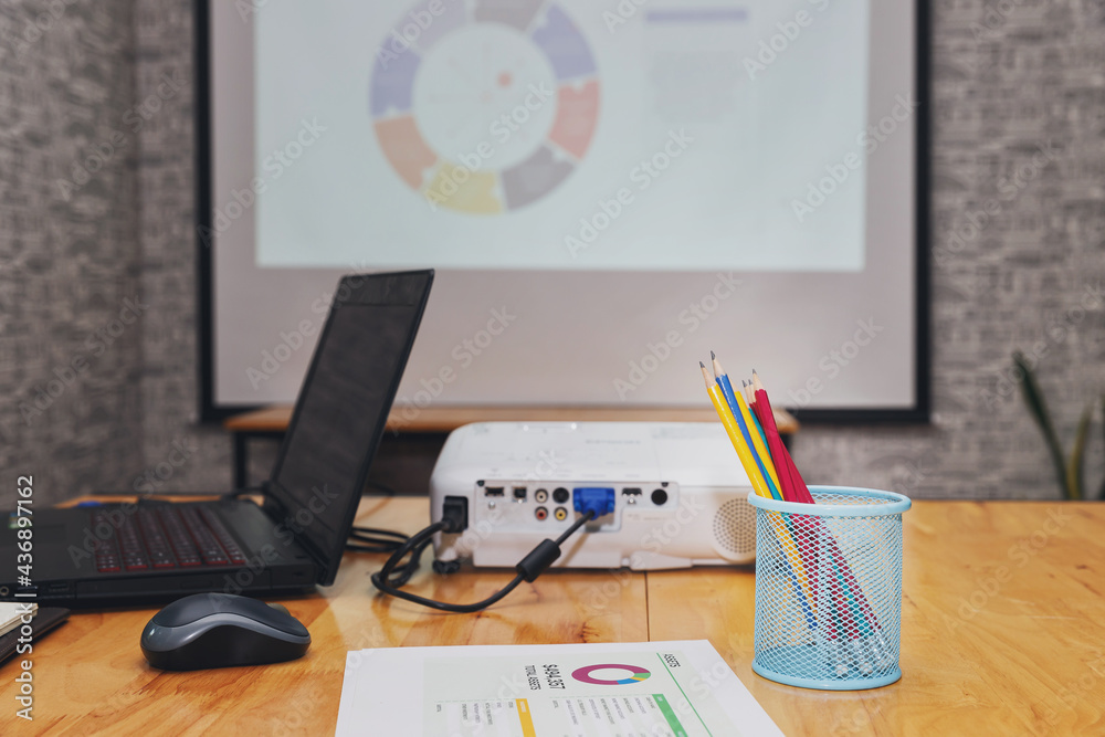 Colorful pencil in box on desk in office. Empty urban meeting room ...