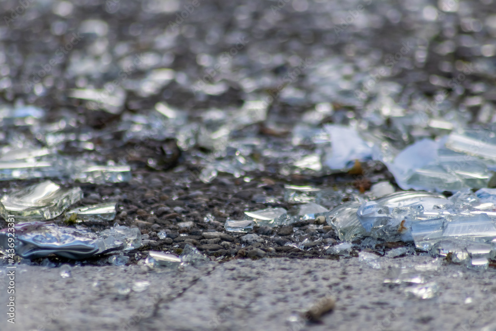 Sharp shards of a broken glass bottle on the ground with sharp blades ...