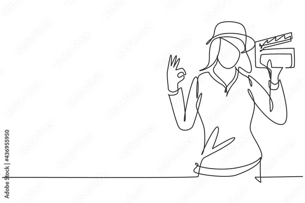 Single one line drawing female film director with gesture okay holding ...