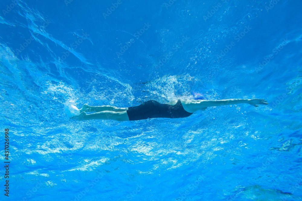 Swimming Girl Athlete unrecognizable training freestyle stroke ...