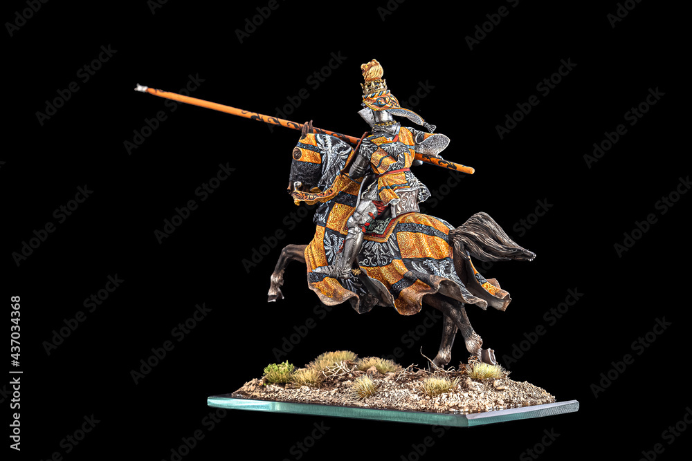 colored chess pieces in the form of people with weapons, a man on a ...