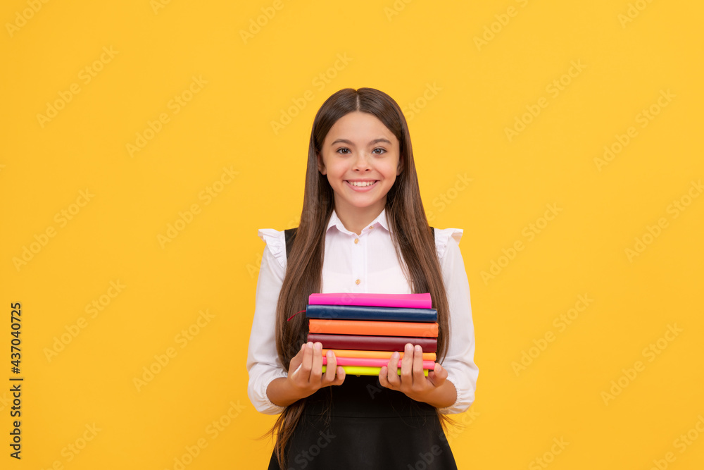happy teen girl in school uniform hold book stack, reading ภาพถ่ายสต็อก ...