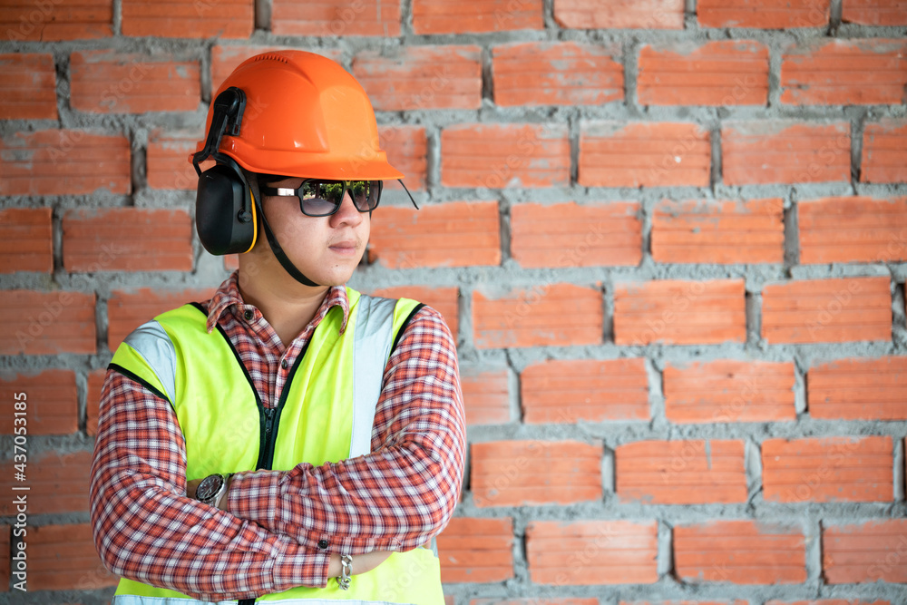 Asian engineer wearing yellow safety vest and hard hat Construction ...