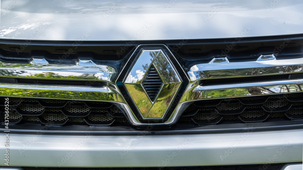 Radiator grill with company logo on Renault Duster Adventure SUV. Close ...