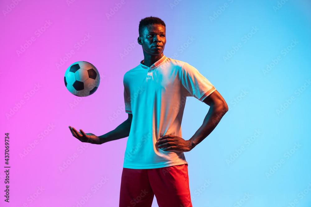Half-length portrait of African professional football player standing ...