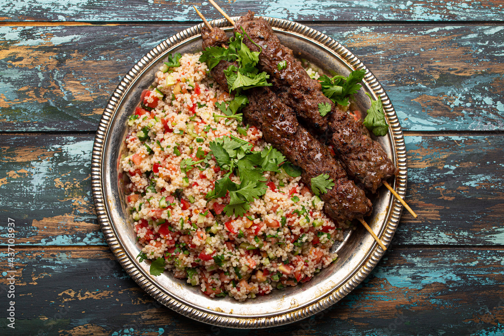 Middle eastern Turkish dinner with meat kebab and couscous salad ...