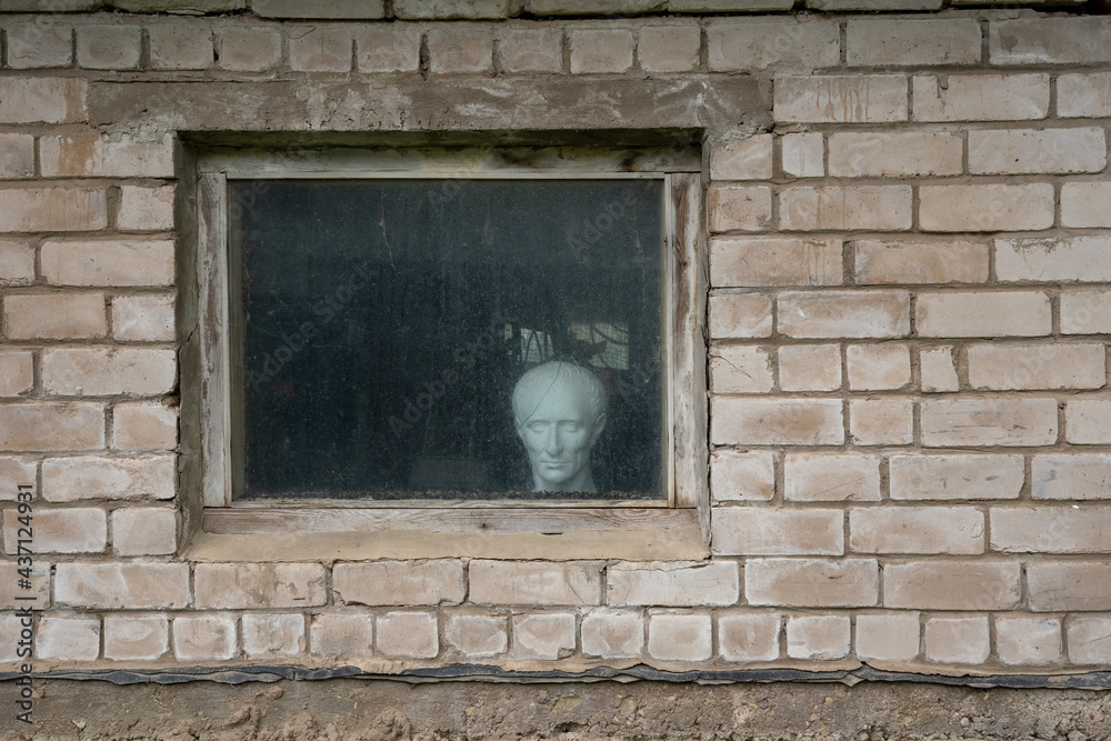 the facade of the white brick building of the Soviet Union with a ...