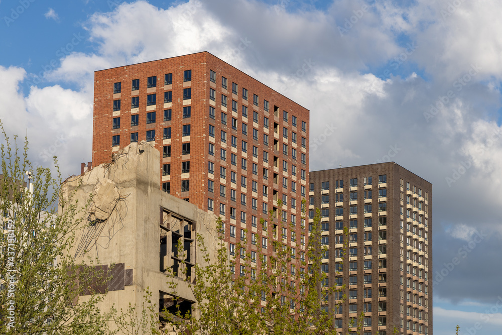 Renovation of housing in a big city. Modern residential high-rises are ...