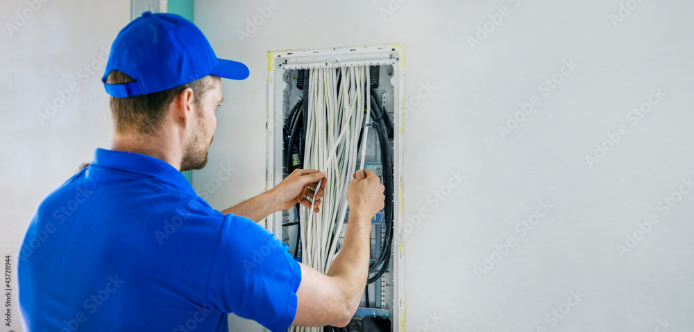 house electrical wiring - electrician working with cables in junction ...