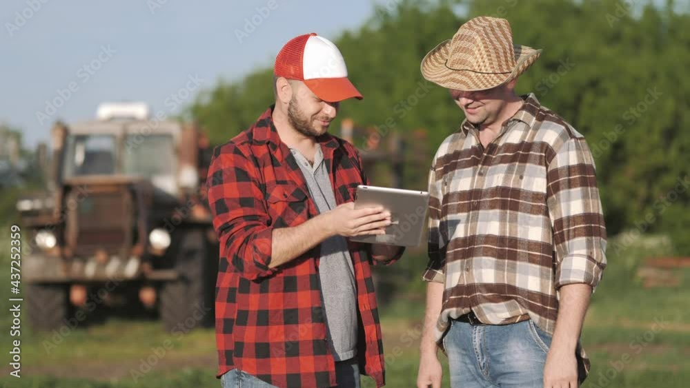 Farming and Technology. Team of mechanics discussion agricultural ...