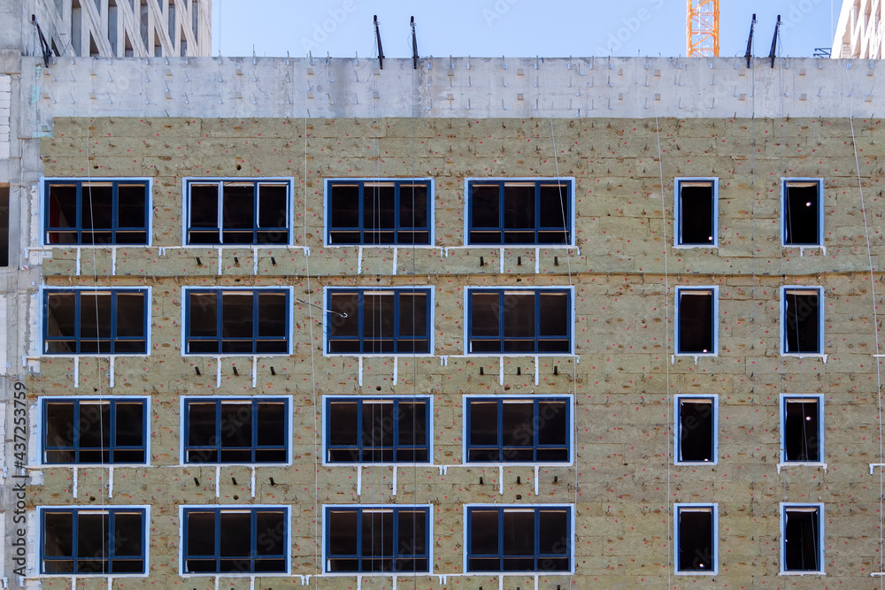 Installation of external wall thermal insulation with rock wool ...
