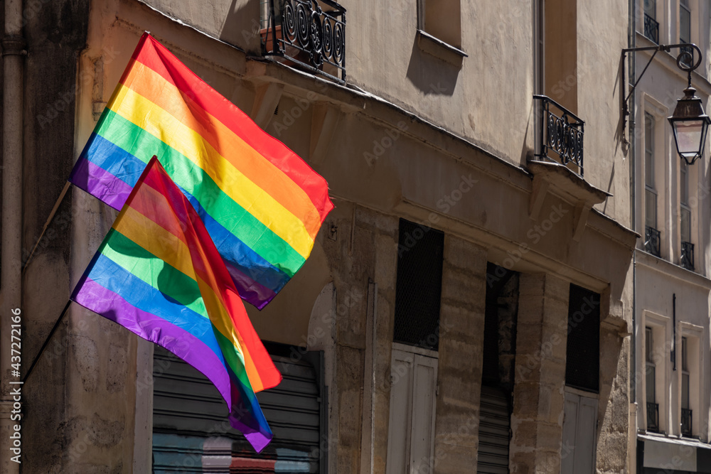 Lgbtq flags hanging at historic building corner during Paris pride ...