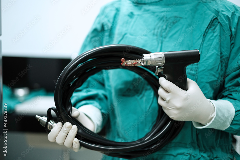 Nurse hold sternal saw which is a bone cutter used to perform median ...