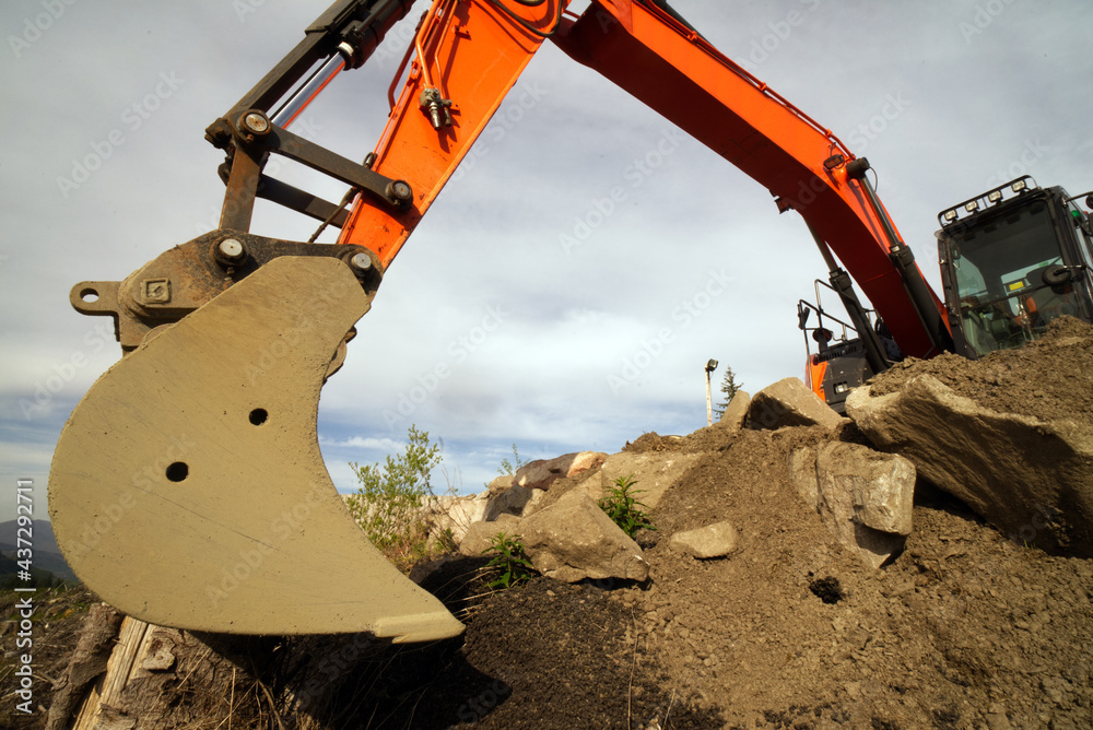 Excavators are heavy construction equipment consisting of a boom ...