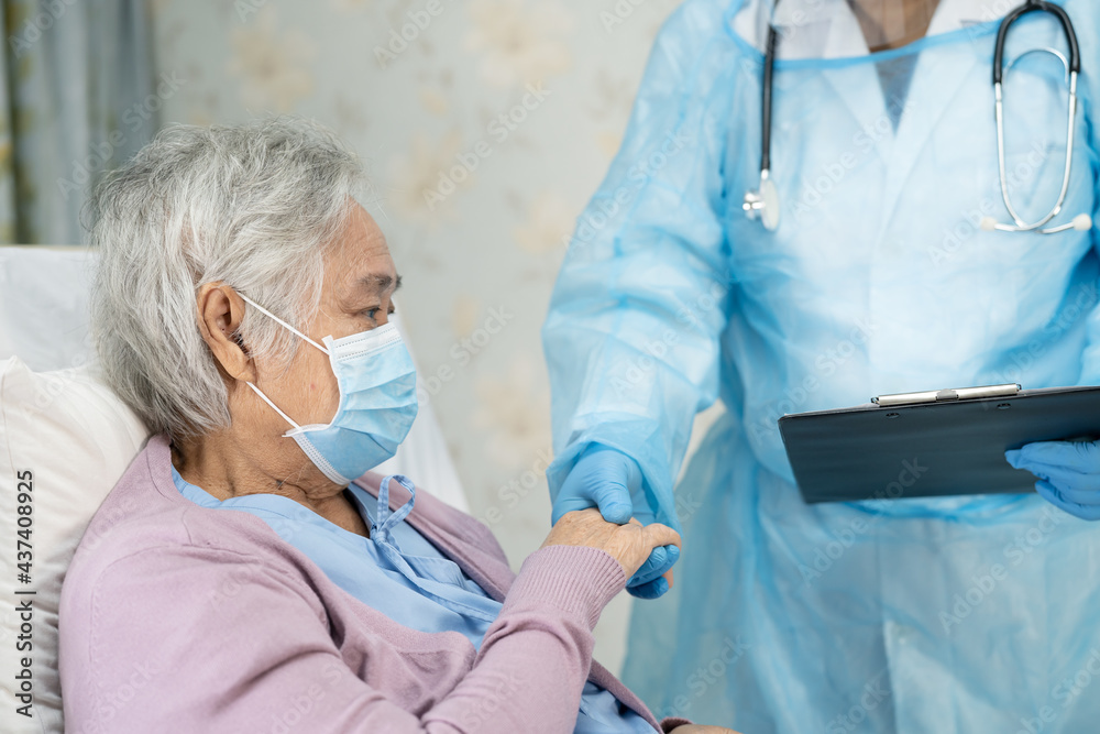 Asian doctor wearing face shield and PPE suit new normal to check ...