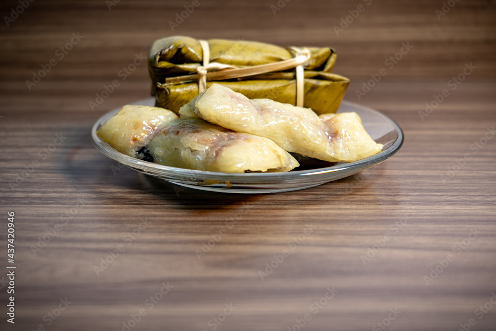 Khao Tom Mud is a Thai dessert made from sticky rice wrapped in bananas ...