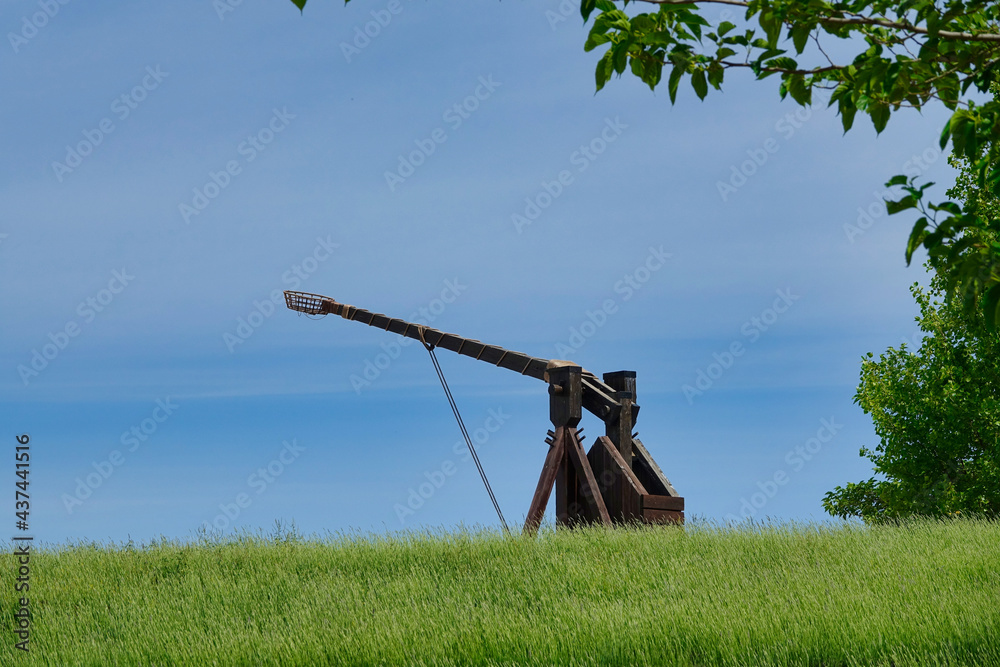 Poster Exterior view of a medieval wooden catapult in the fortress of ...