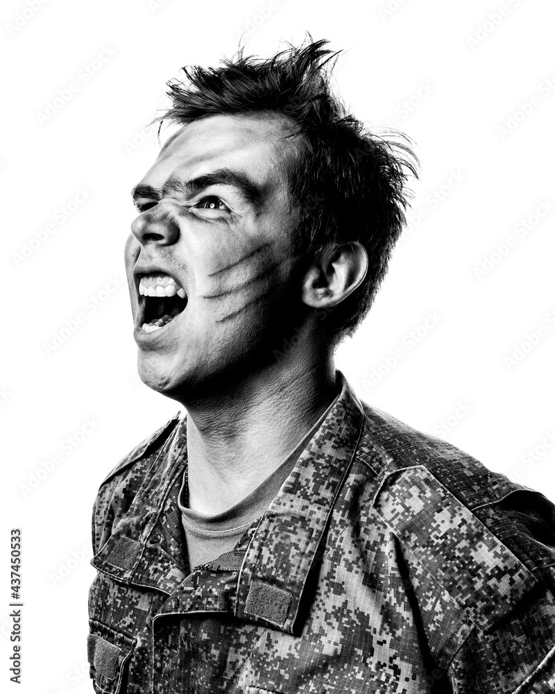 A young soldier in military uniform, a combat coloring with scars and ...