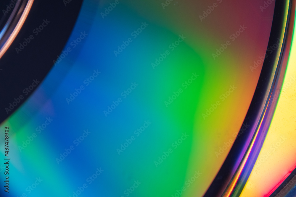 Abstract photo of the reflection of the bottom of a CD displaying a ...