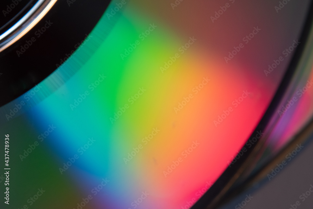 Abstract photo of the reflection of the bottom of a CD displaying a ...