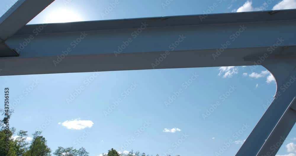 iron steel frame construction of bridge on blue sky background. bridge ...