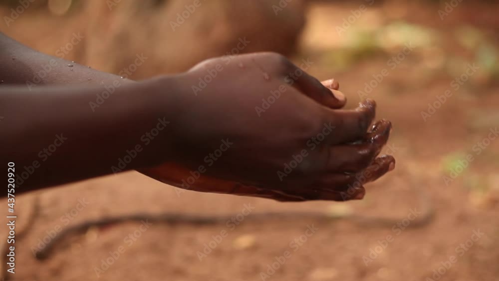 The black African American man washes his hands the best way with soap ...