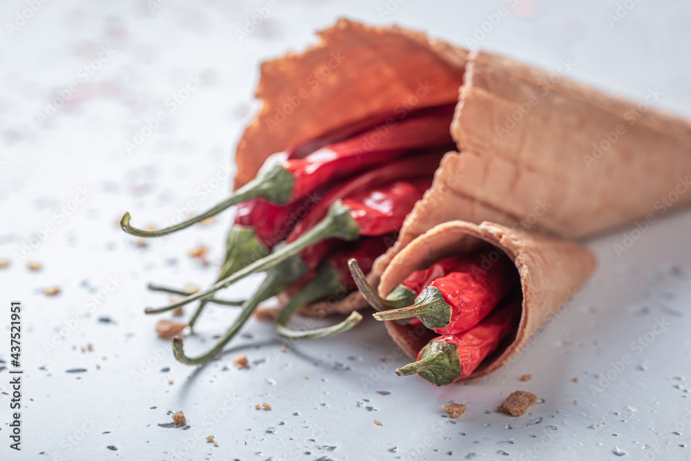 Chilli peppers in ice cream cone. Spicy ice cream. Stock Photo | Adobe ...
