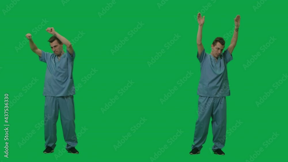 Portrait of young man in a blue suit of a surgeon doctor dancing and ...
