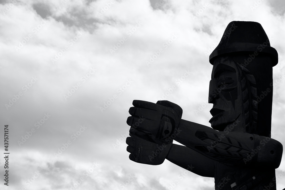 Salish Grandfather carved wooden welcome figure pole on First Nations ...