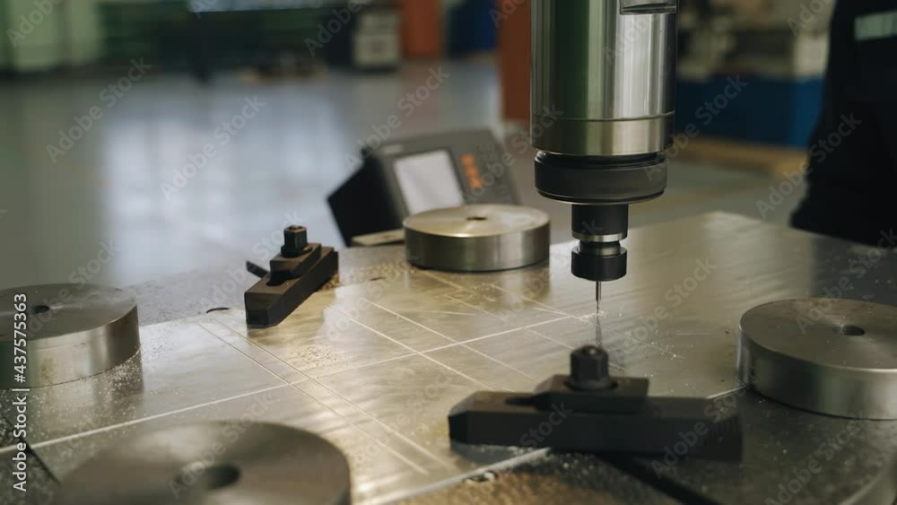 The spindle of the milling machine rotates while processing the part ...